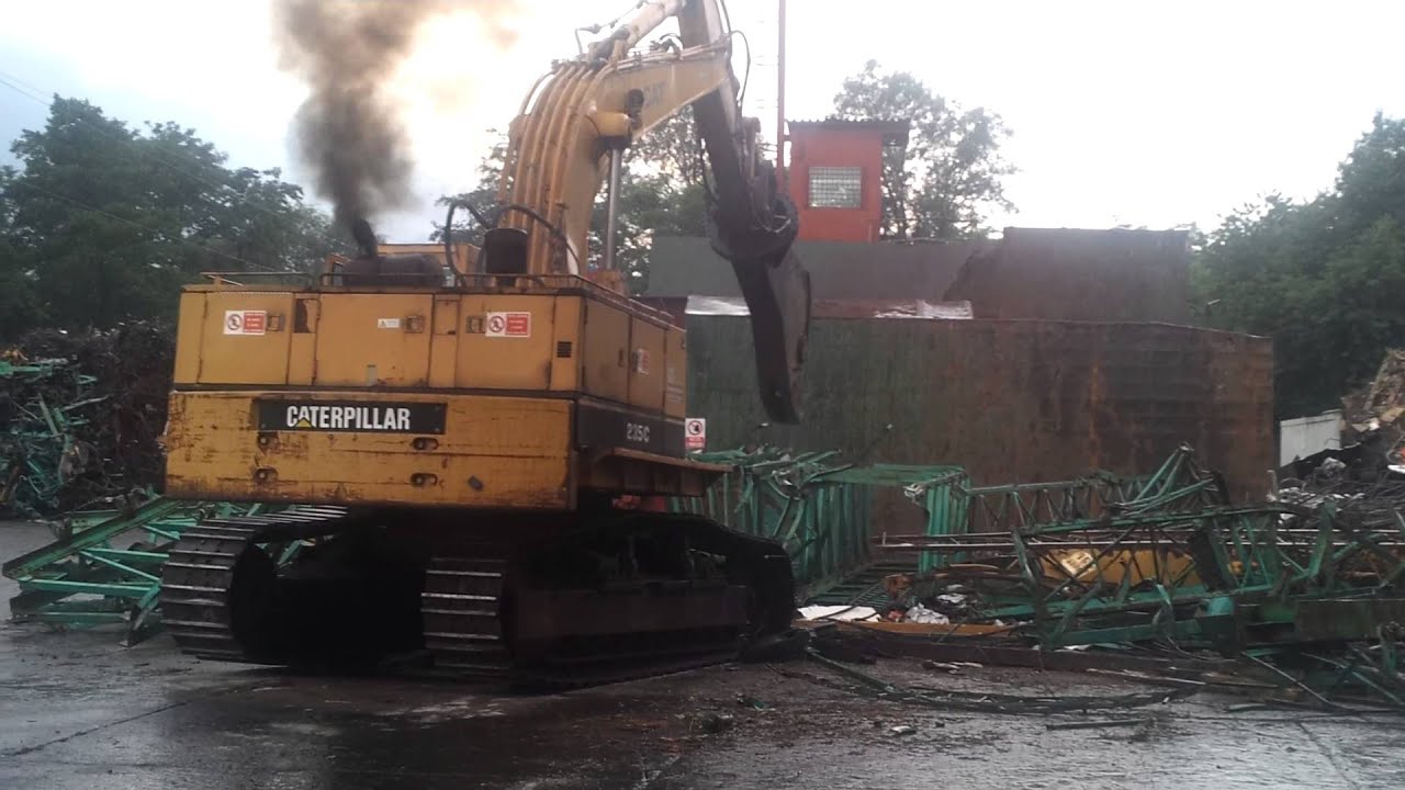 CATERPILLAR 235C con cesoia CMI 550 K - YouTube