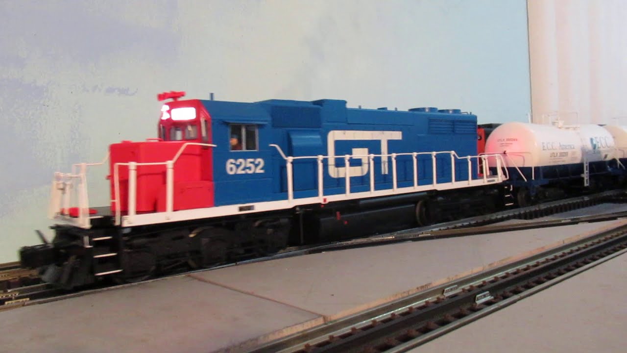 O scale Grand Trunk Western SD38 pulling a freight train with ann arbor ...