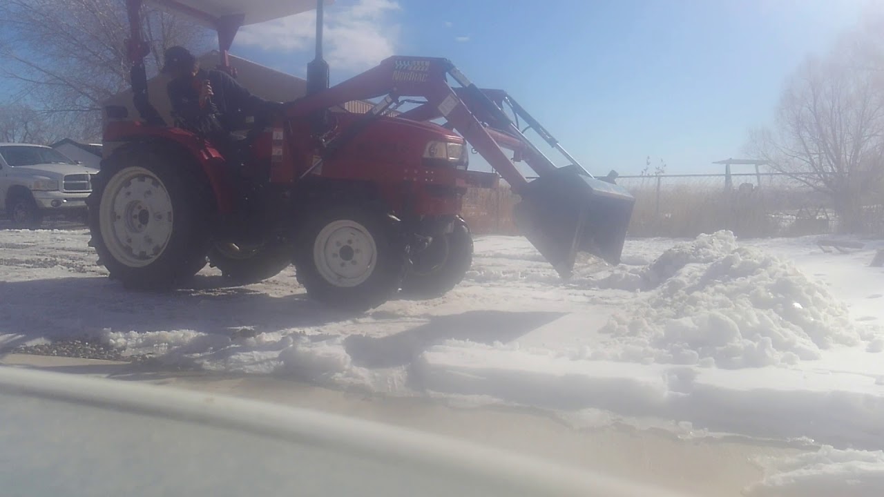 Nortrac tractor scraping ice. - YouTube