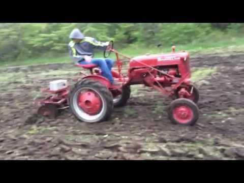 Farmall cub discing a wet field - YouTube