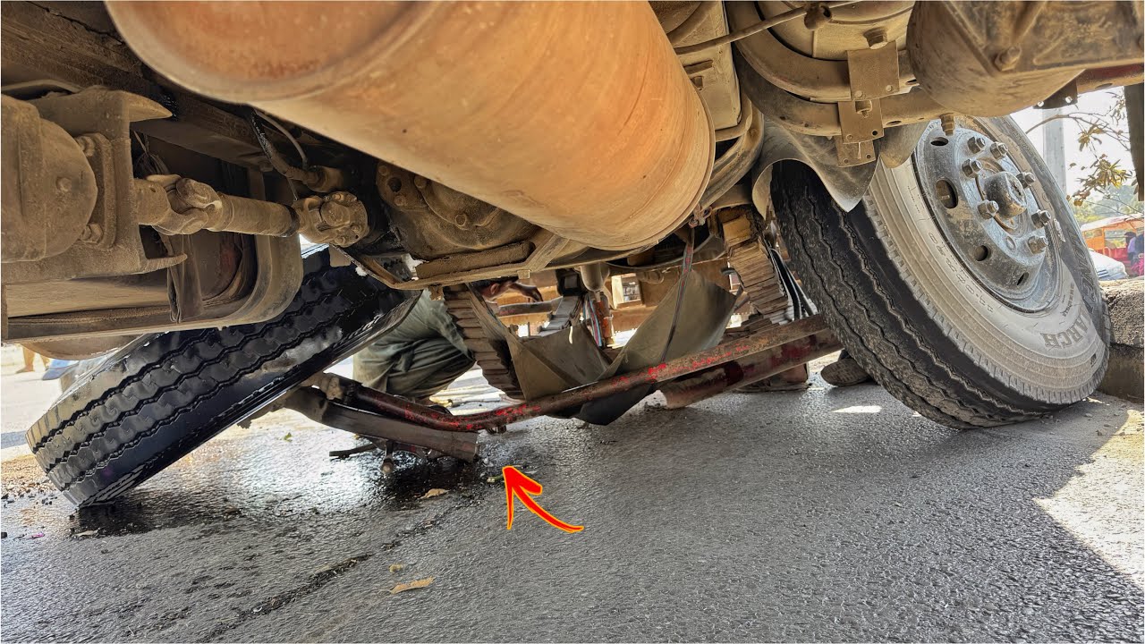 “Mechanic at Work: Repairing a Heavy Truck’s Front Axle and Diagnosing ...