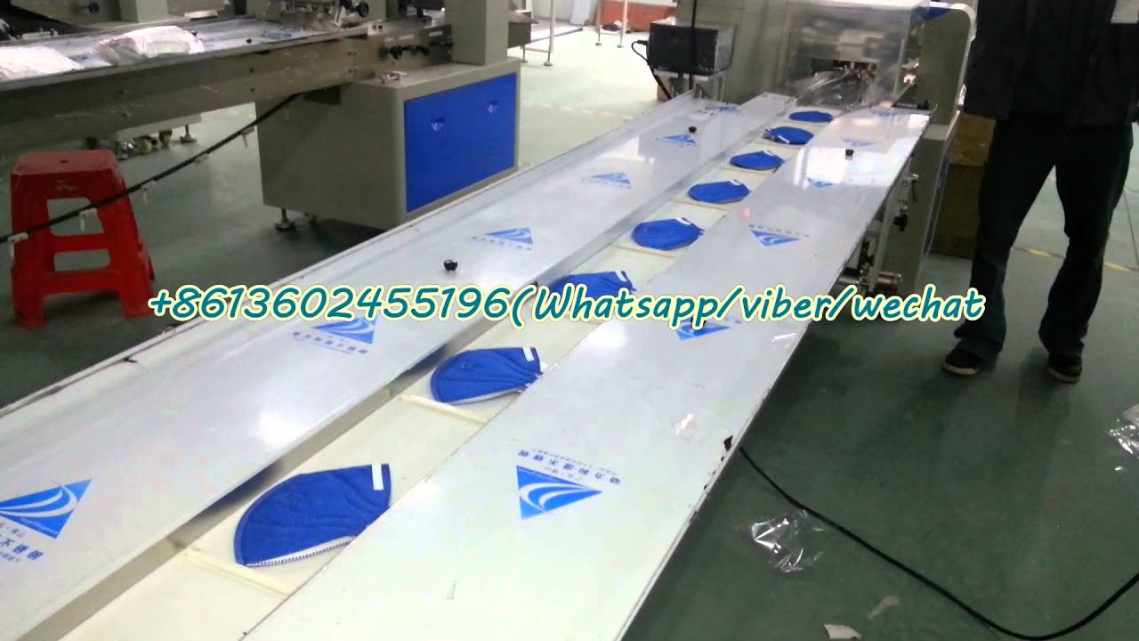 Automatic horizontal face masks packing machine - YouTube
