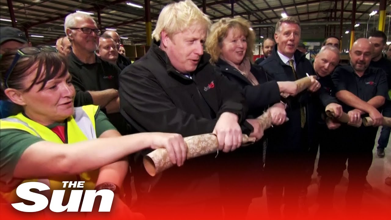 Boris Johnson gets festive and pulls crackers with staff at a Christmas ...