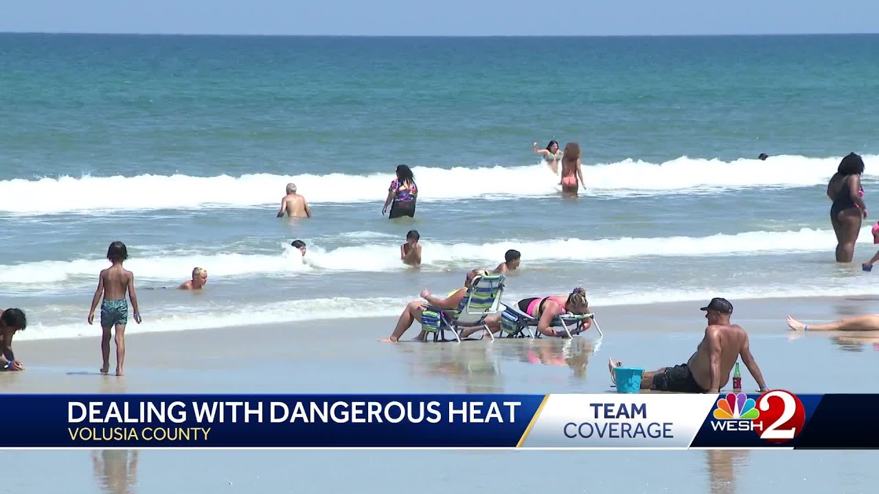 Beaches are packed in Central Florida during scorching temps - YouTube