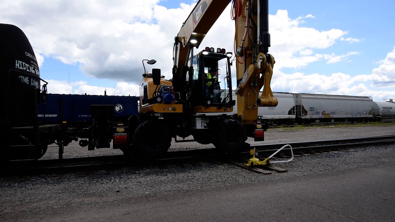 Cat M317F Hi-Rail Wheeled Excavator Railcar Mover - YouTube