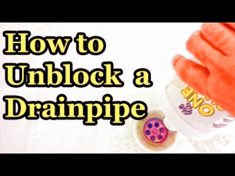 Unblocking a blocked drain waste pipe - YouTube