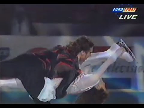 Beautiful ice skater does SPLITS upside down in slow motion