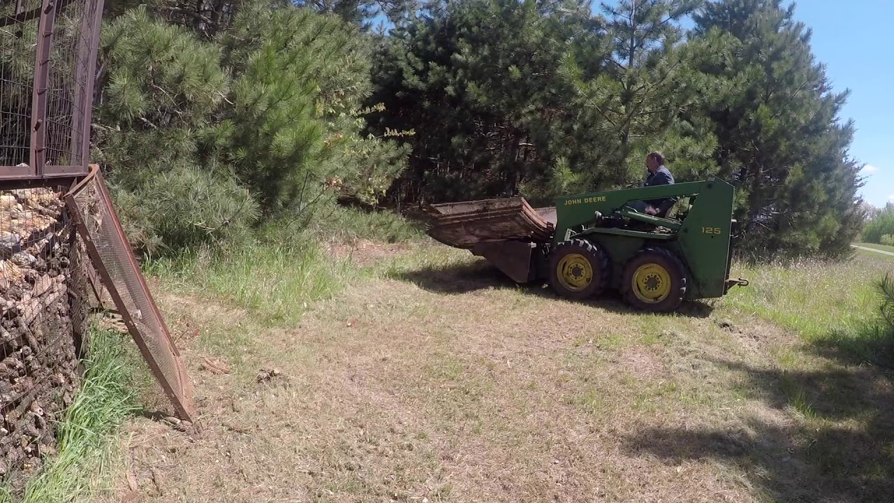 making fence from corn crib panels for the goats . John Deere 125 skid ...