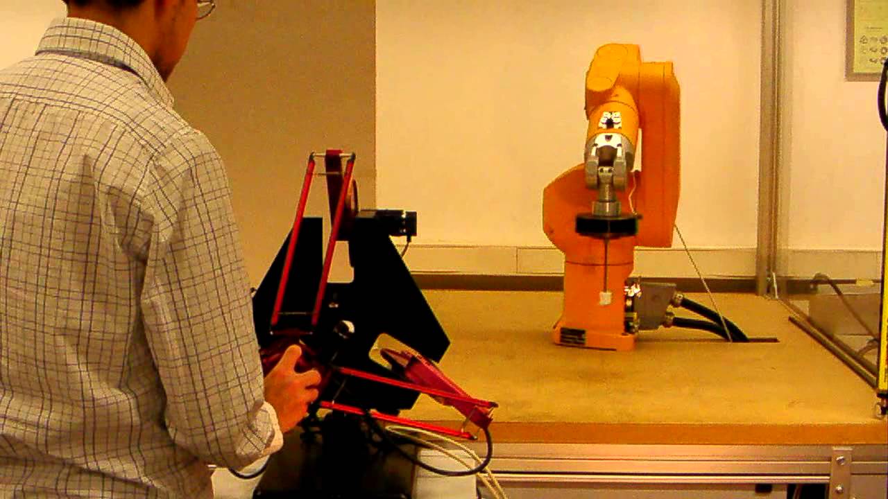 Teleoperation of a Robot Arm Through a Haptic Device - YouTube