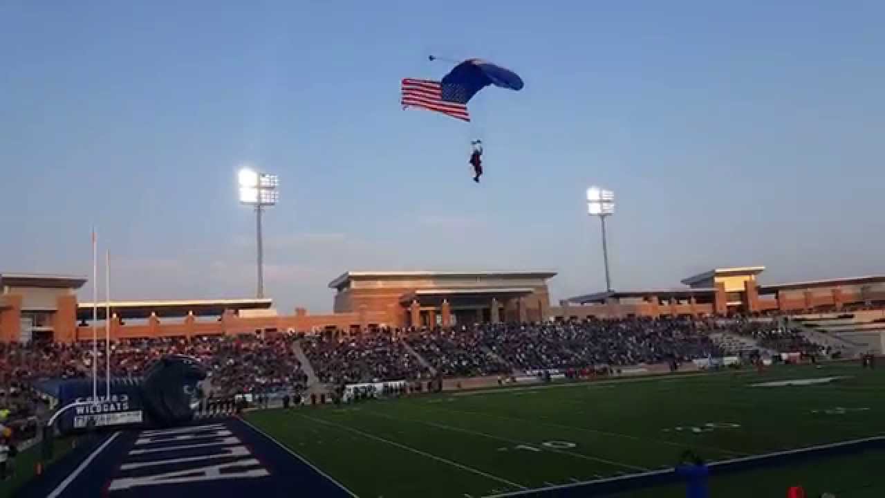 Skydivers entering Allen's Eagle Stadium - YouTube
