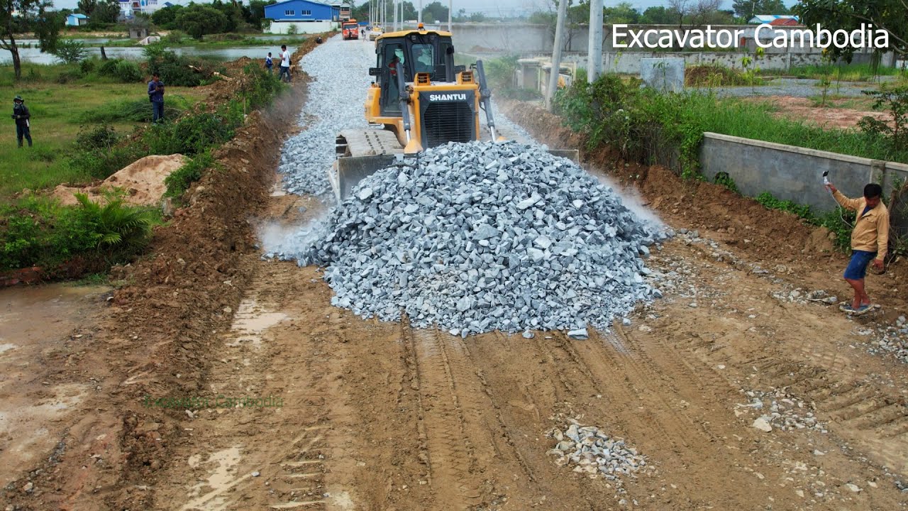 Dozer Spreading Gravel And Dump Trailer Working Unloading Gravel ...