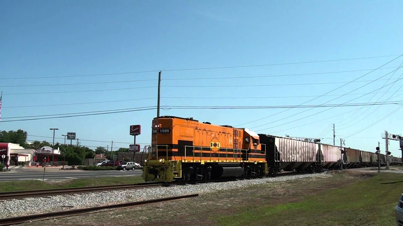 Bayline railroad local manifest train heads through Panama City Florida ...