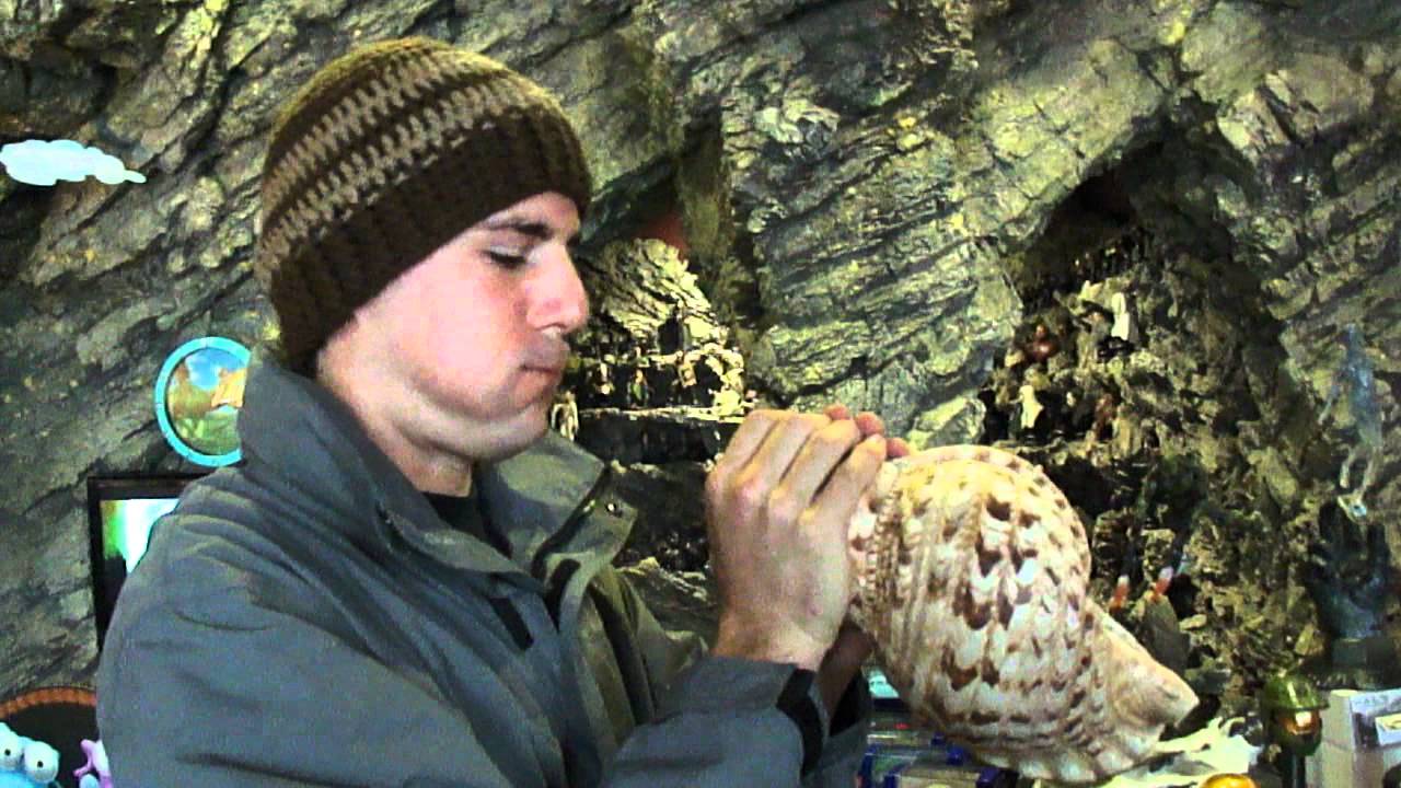 Playing a conch shell at the Weta Cave - YouTube