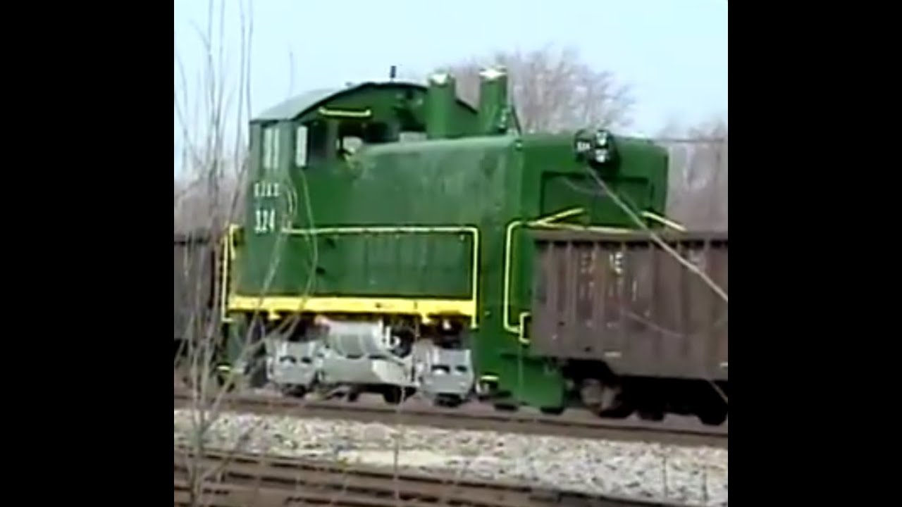 CN E249 with GP9RM. Green EJ&E switcher at Munger. 2/29/04. - YouTube