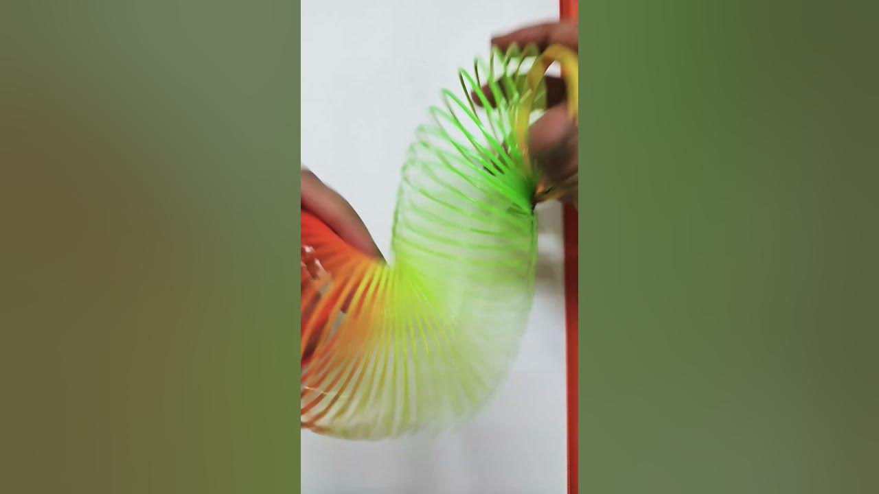 Having fun with my slinky rainbow fidget toy #shorts #slinky #fidget #fun #play - YouTube