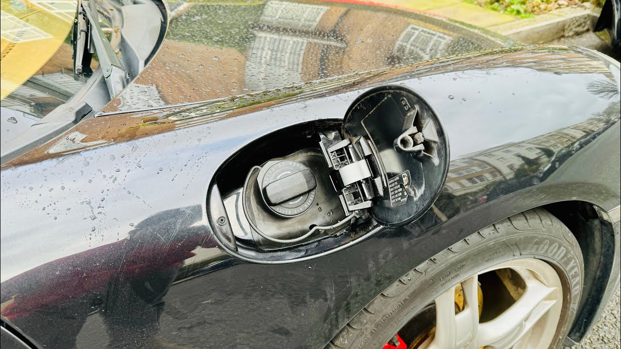 Porsche fuel filler flap hinge 996 997 987 986 boxster cayman - YouTube