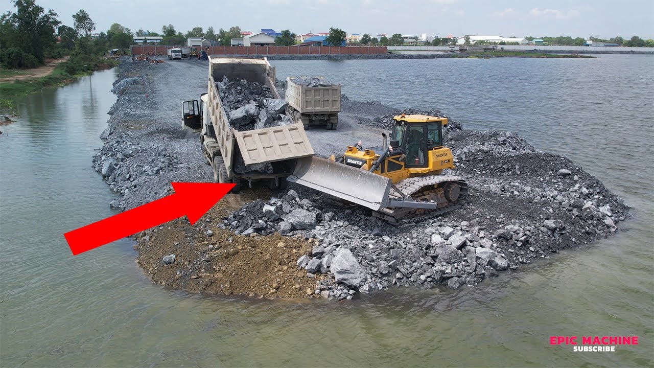 The top performing bulldozer in action, vigorously pushing a pile of ...