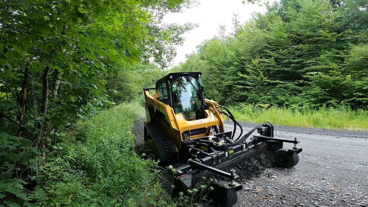 Power Raking a Gravel Road with Caterpillar 259D3 PR121 and CV119 - YouTube