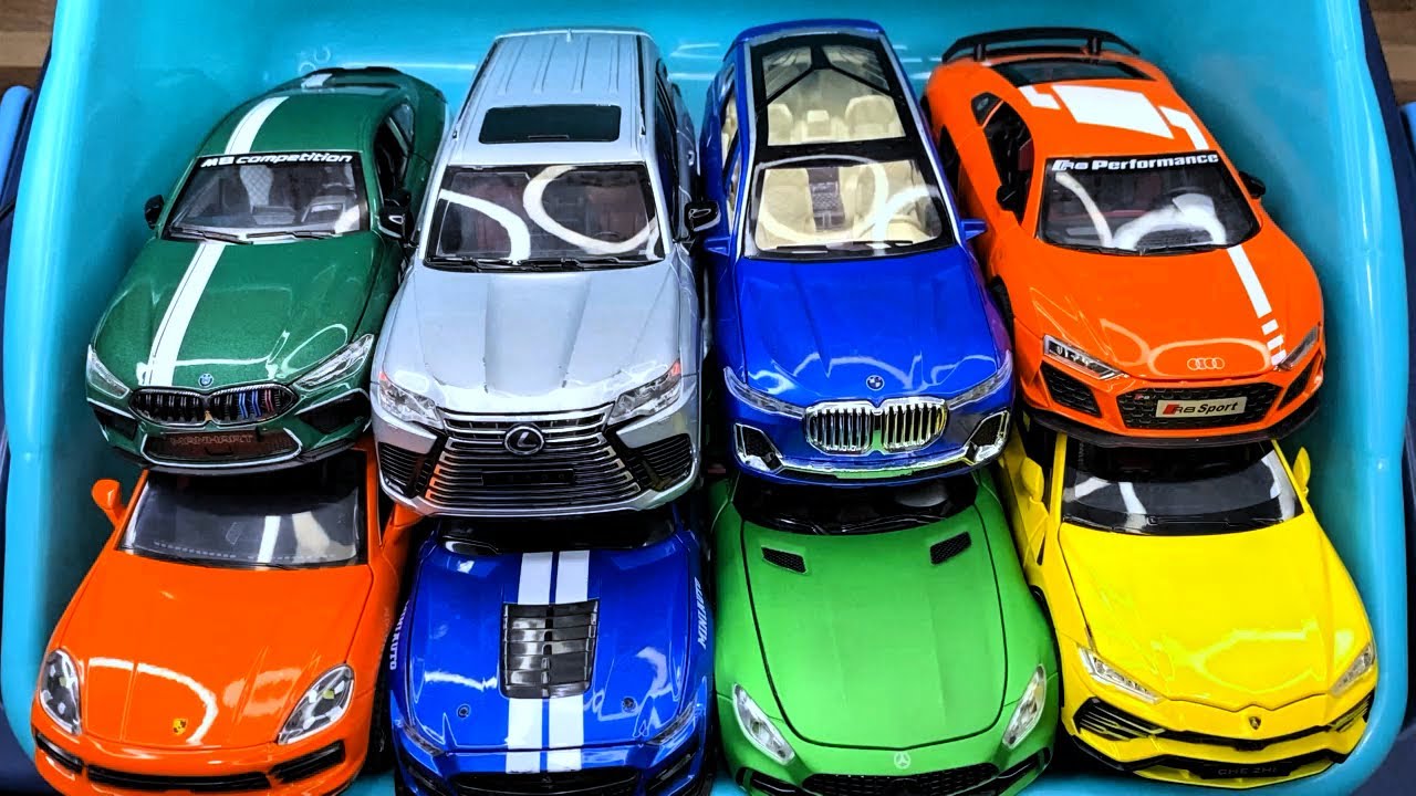 Box full of various miniature cars Jaguar, Peugeot, Renault, Hyundai ...