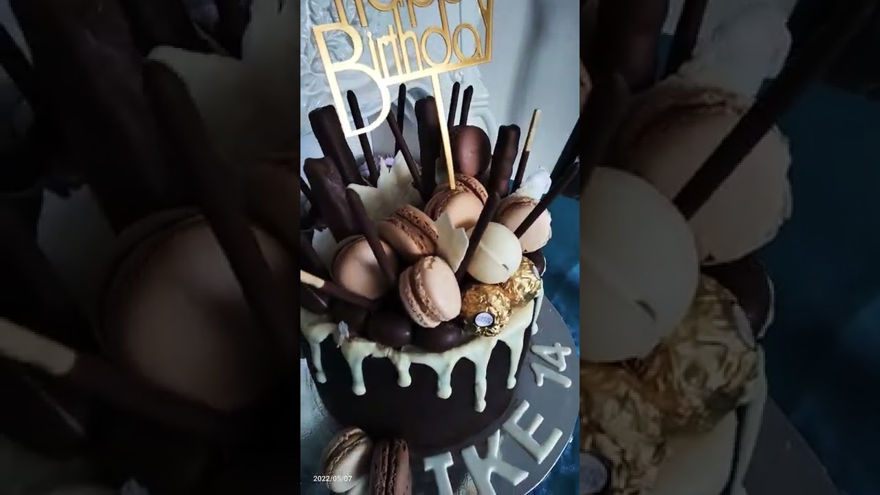 video of white chocolate drip cake decoration with assorted toppings of ...