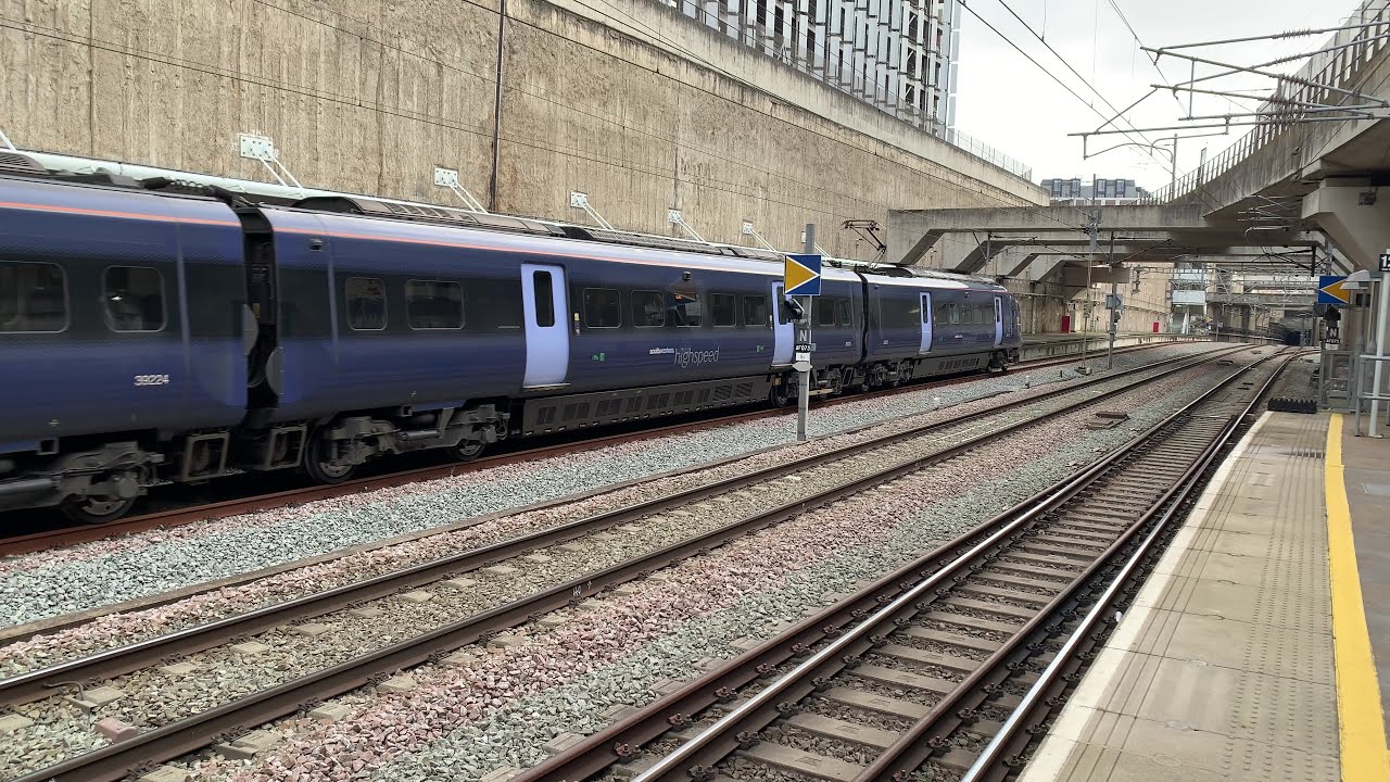 Southeastern class 395 pair depart the Eurostar platforms at Stratford ...