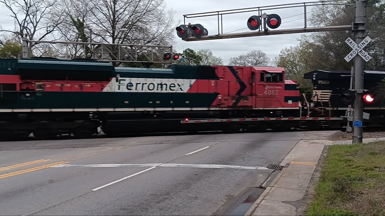 NS 7523 and Ferremox SD70ace leads NS 191 out of Columbia SC at Huger ...