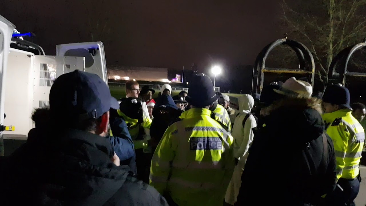 Crazy guy getting arrested trying to head-butt the police speaker ...