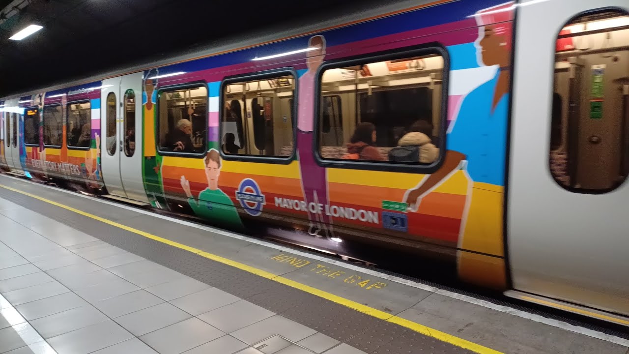 Pride livery Elizabeth Line class 345 departs Heathrow Terminals 2&3 ...