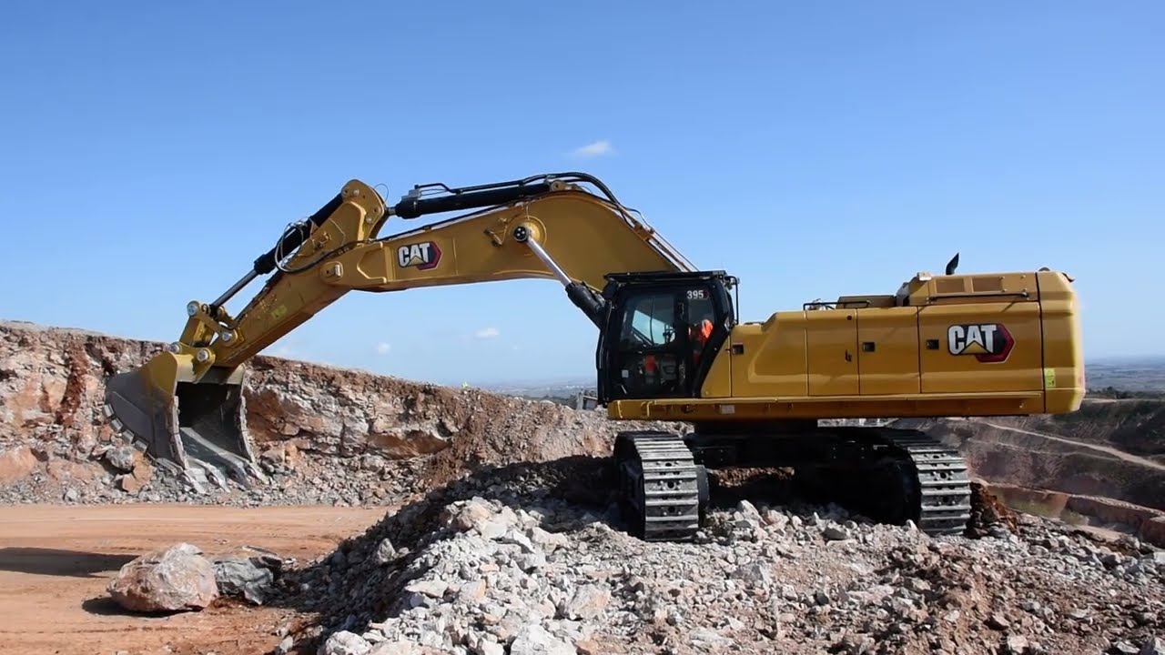 Caterpillar 395 Next Gen loading 771D - YouTube