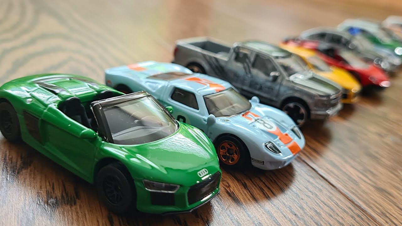 Miniature diecast cars parking next to each other ...