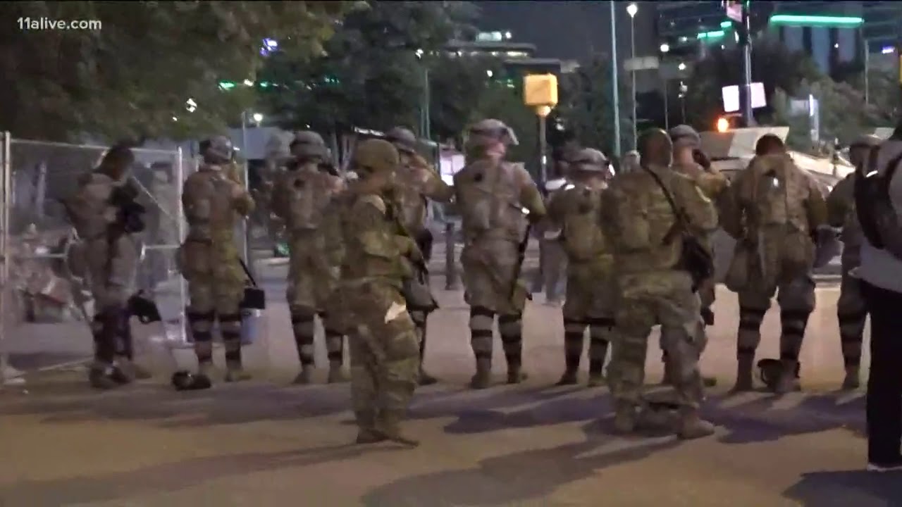 Protesters leave Downtown Atlanta once curfew hits - YouTube