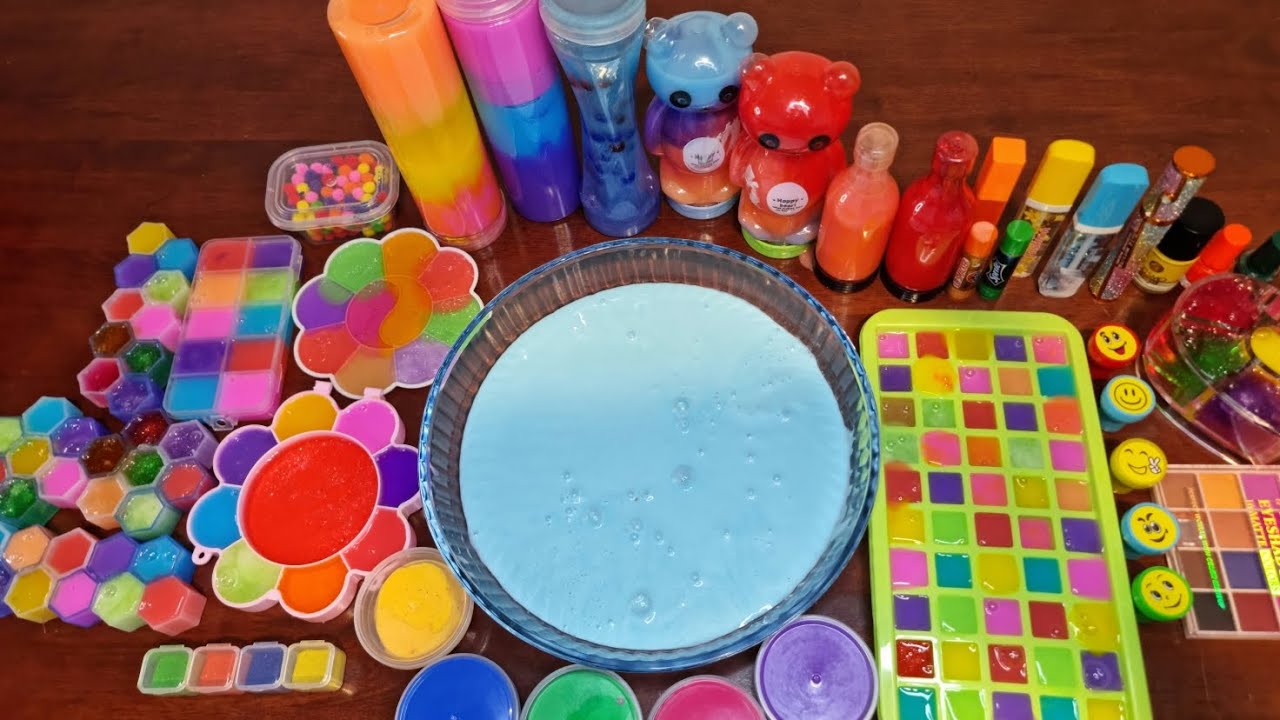 A blend of colorful slimes with beautiful nail paint and eyeshadows ...