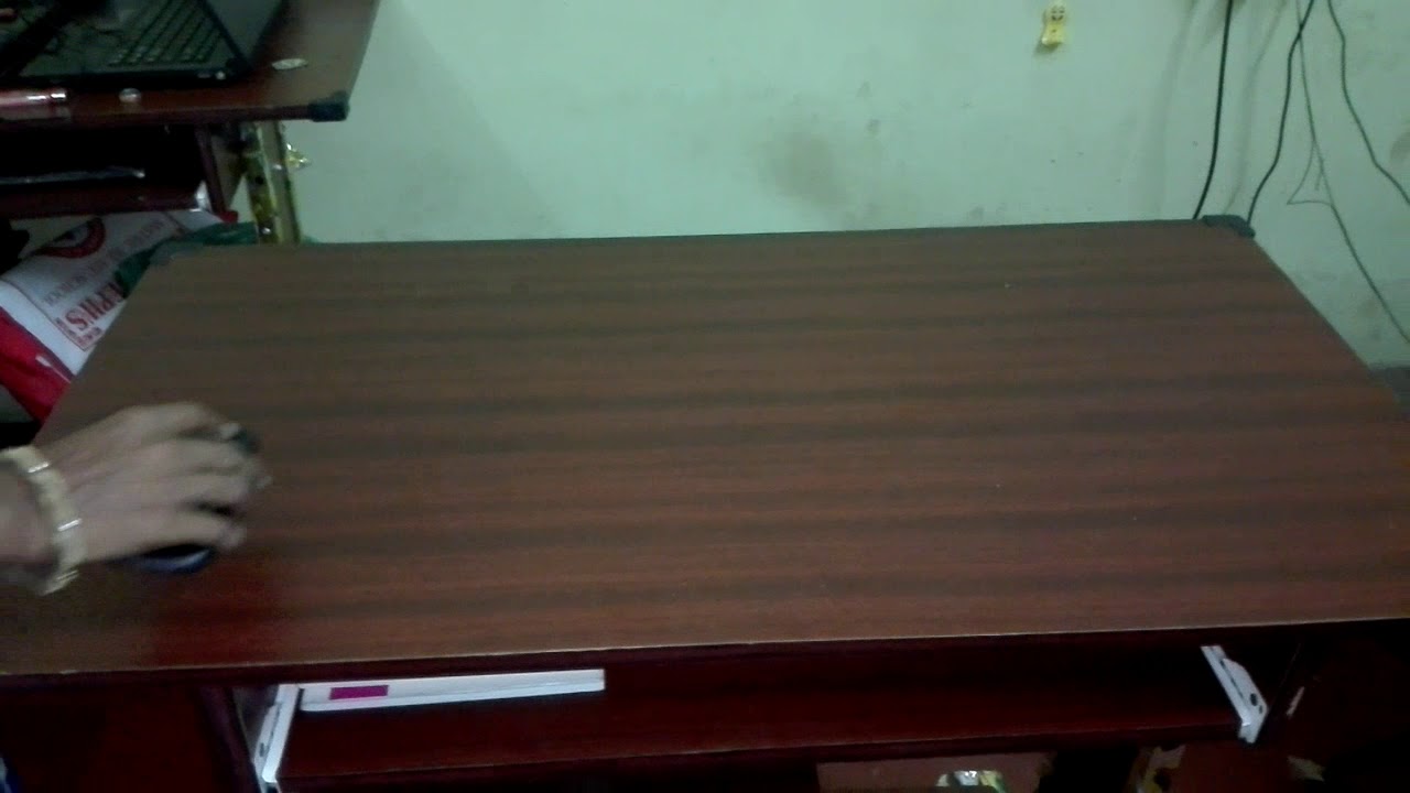 Putting mobile phone on the wooden table - YouTube