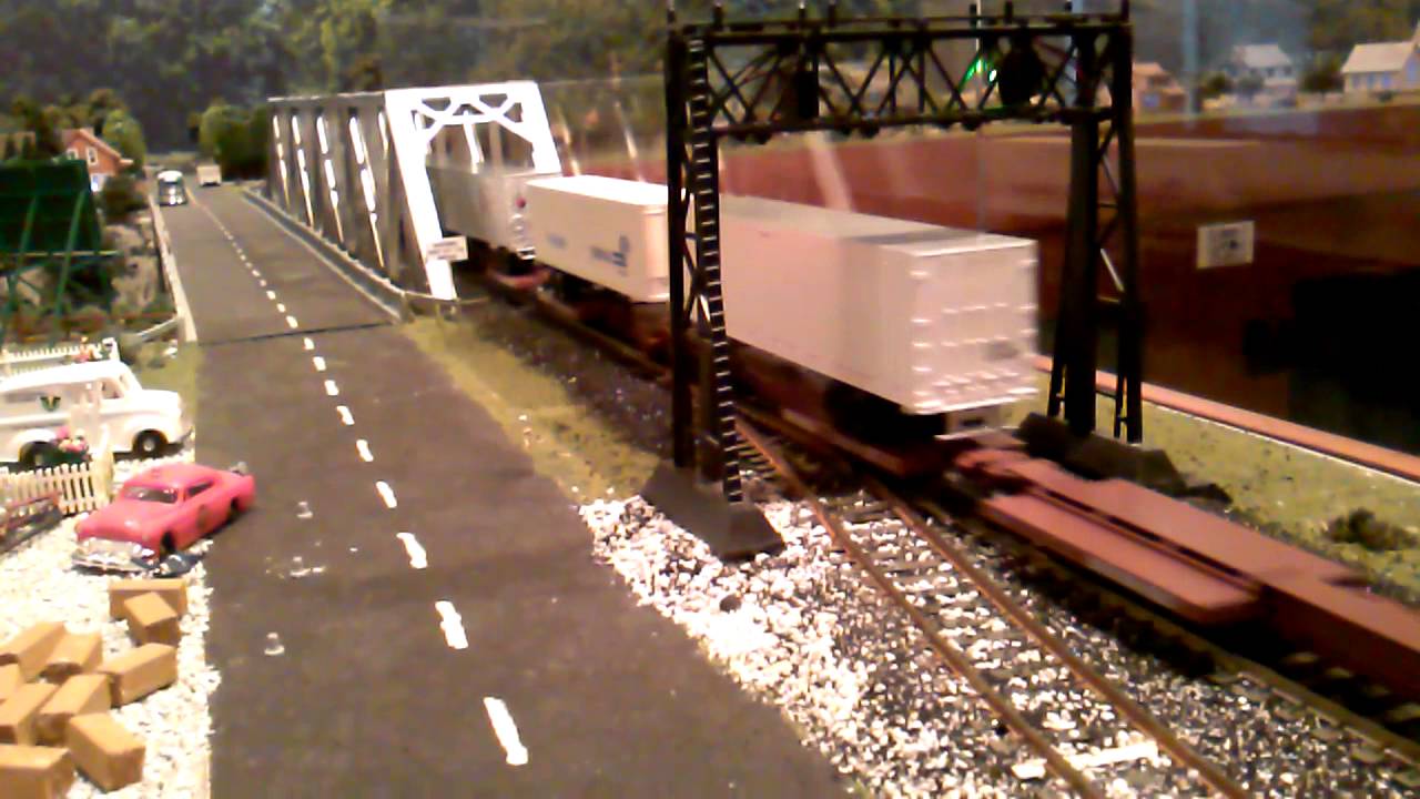 ho scale ns freight train crossing creek bridge - YouTube