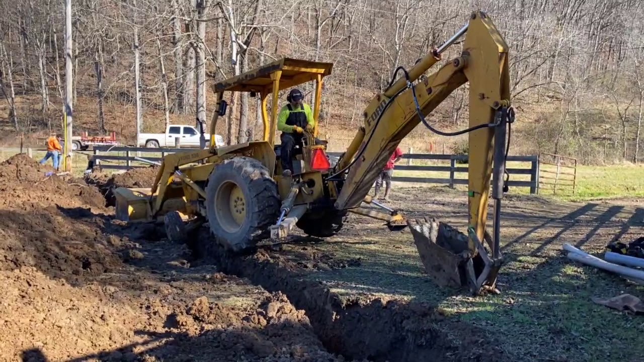 Moving Backhoe Across Trench - YouTube