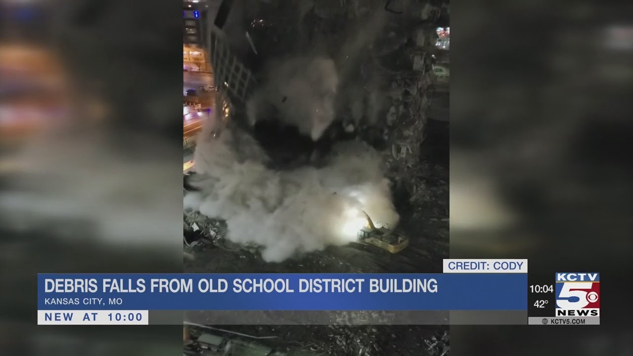 Debris from ongoing demolition of old KCPS building lands in road - YouTube