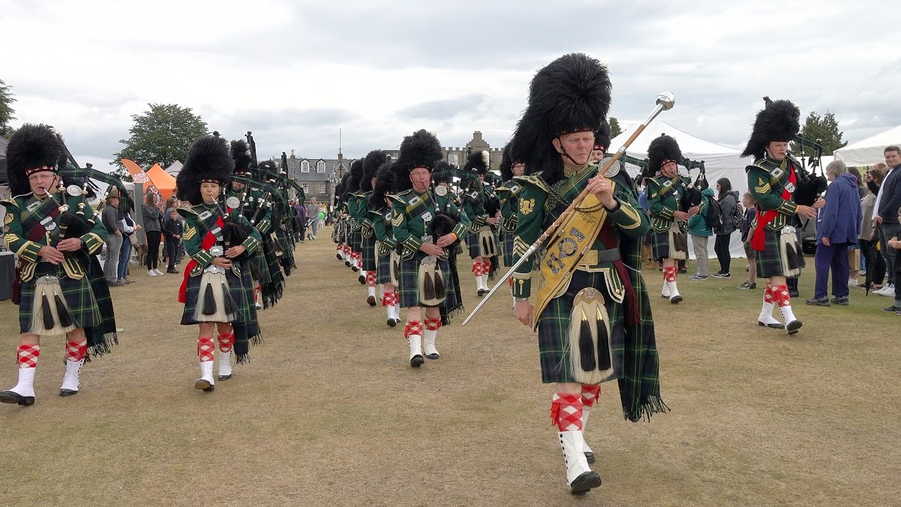 Drum Major Derek Dean leads Huntly Pipe Band on the march during the ...