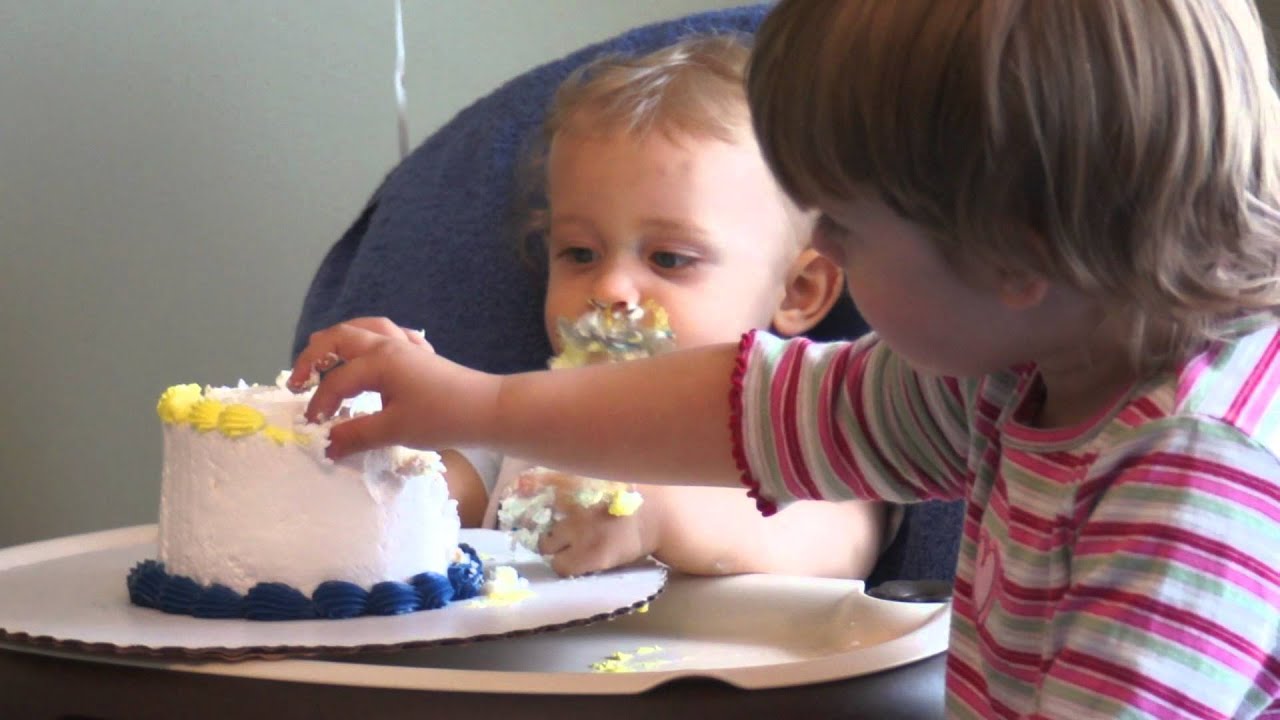 Baby eats first smash cake - YouTube