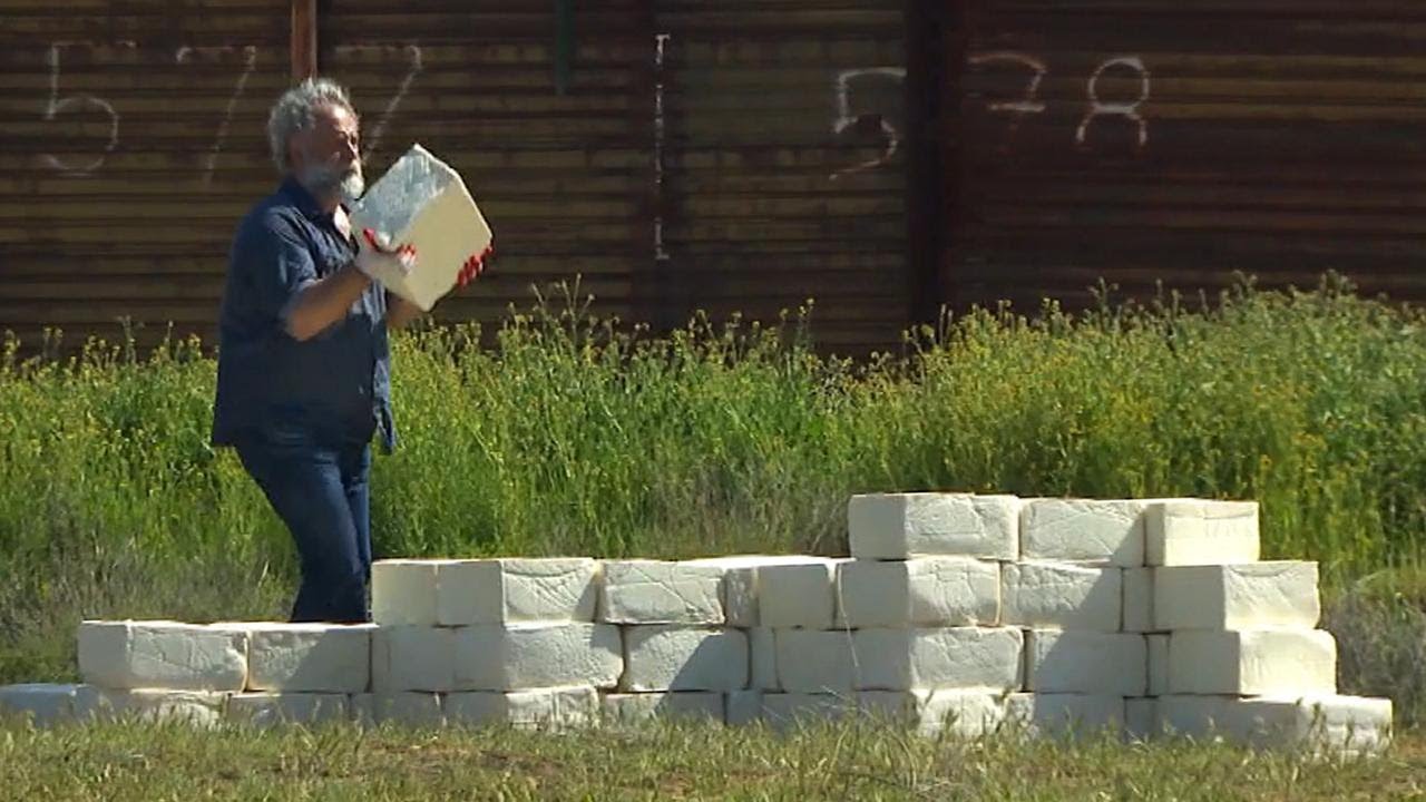 Artist Builds Wall of Cheese to 'Make America Grate Again' - YouTube
