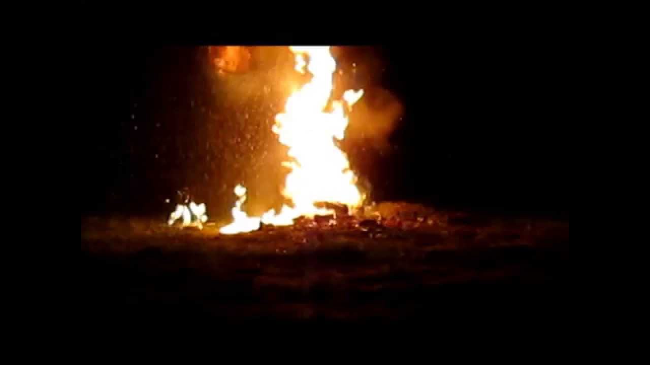 Spray can explosion in campfire - YouTube