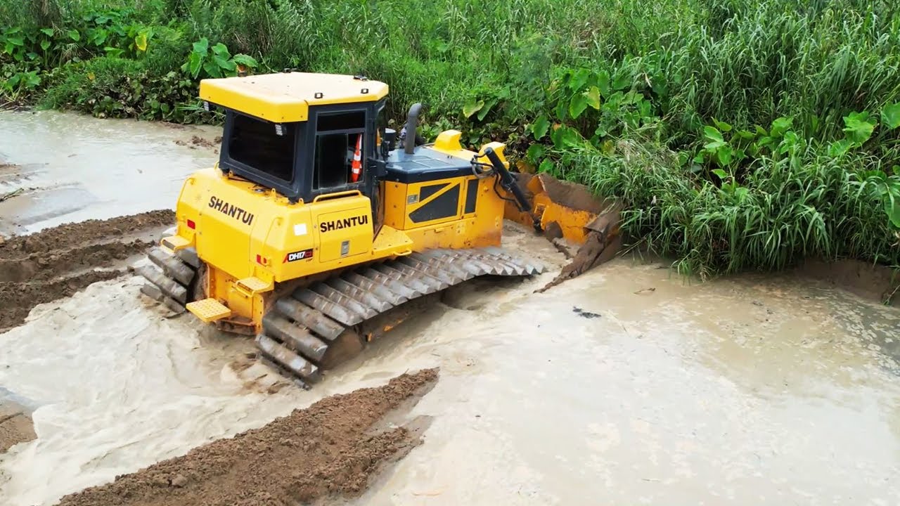 Invincible Operator Bulldozer Moving Sand Into Water Best Landfill ...