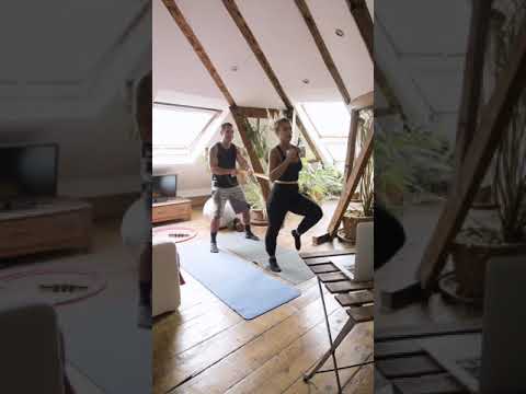 Man And Woman Exercising at Home