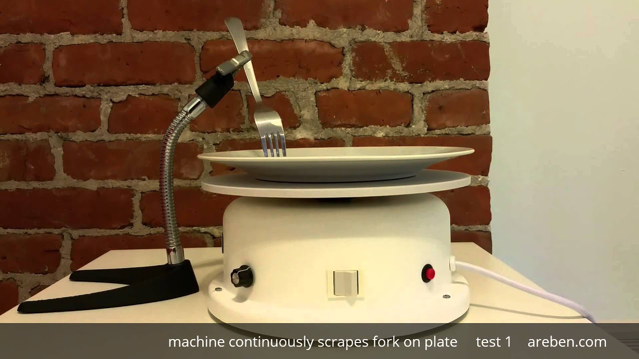 machine continuously scrapes fork on plate, test 1 - YouTube