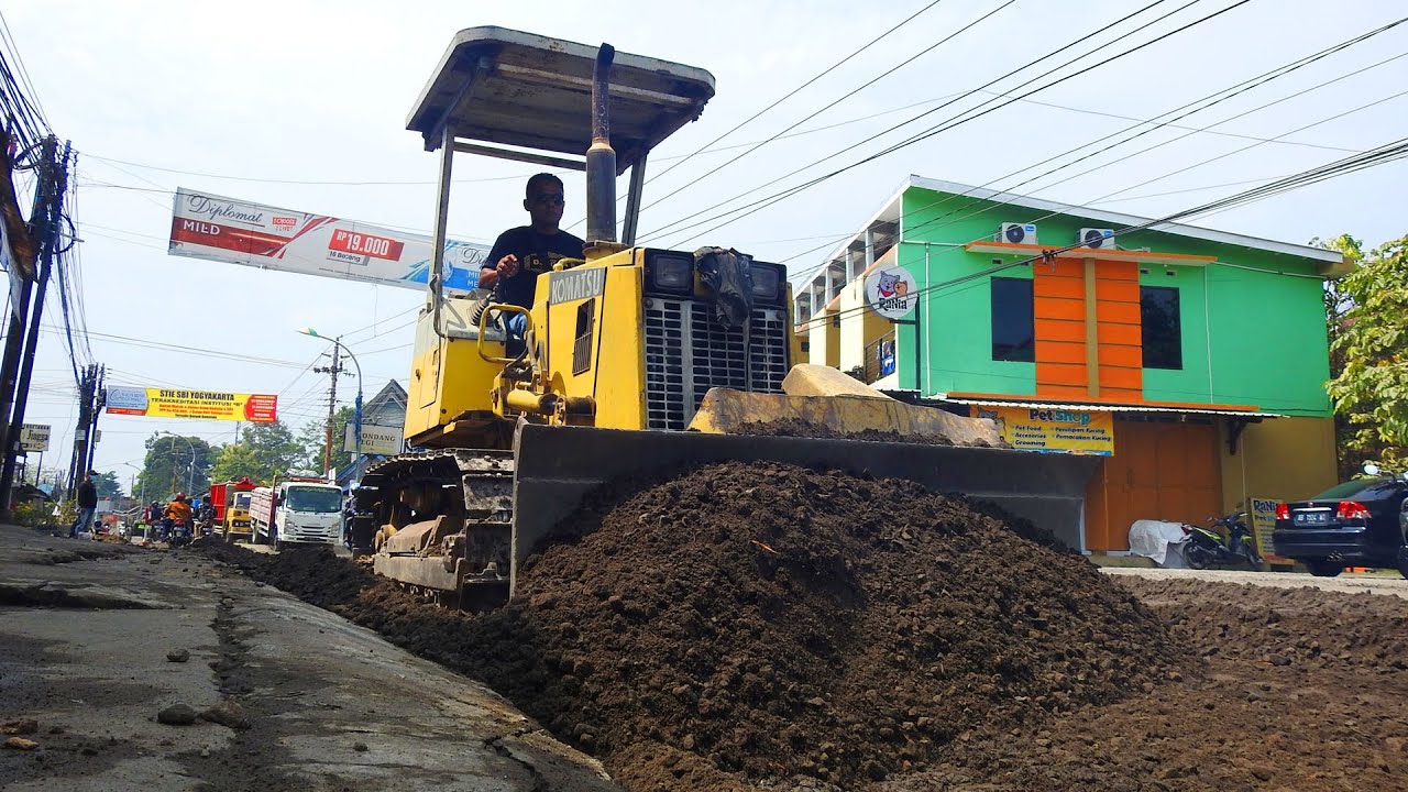 Mini Dozer Komatsu d21p grading gravel on a new road layer project ...