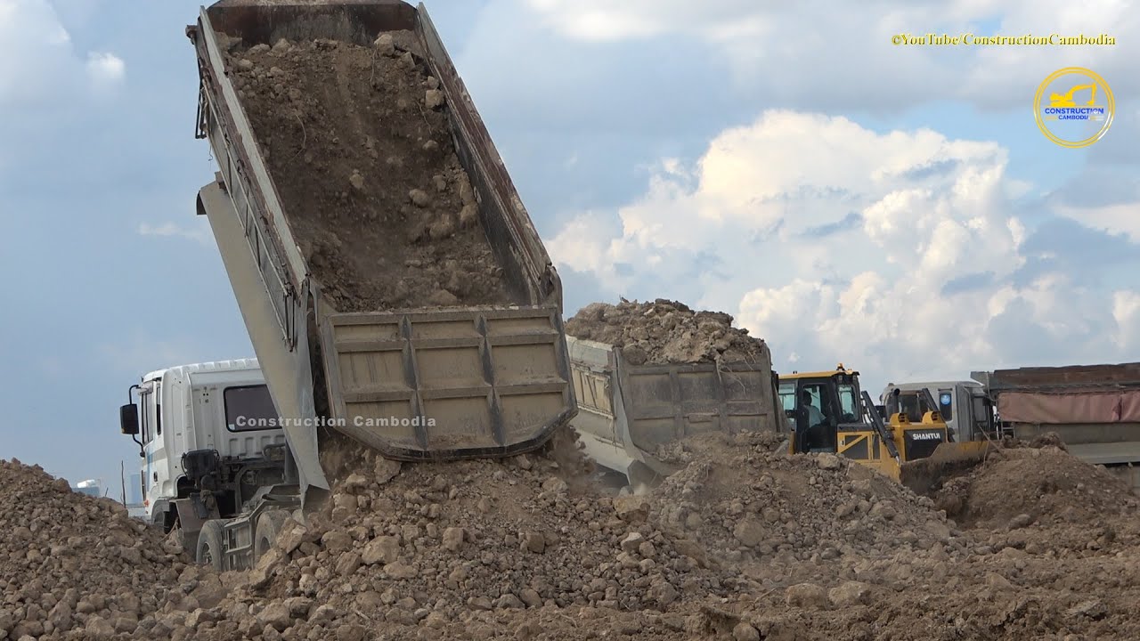 Big Dozer, Large Dump Trucks Work To Fill To High - YouTube