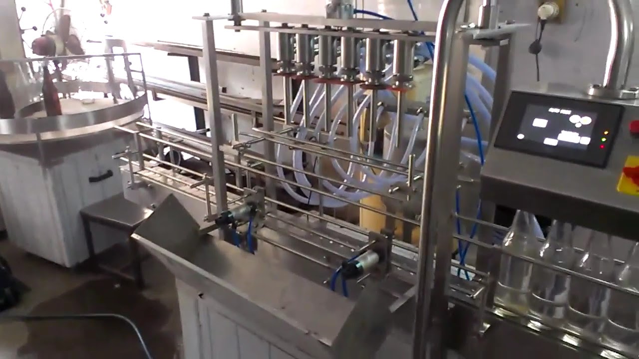 Bottle Vacuum filling machine , Overflow Filler for Glass bottle - YouTube