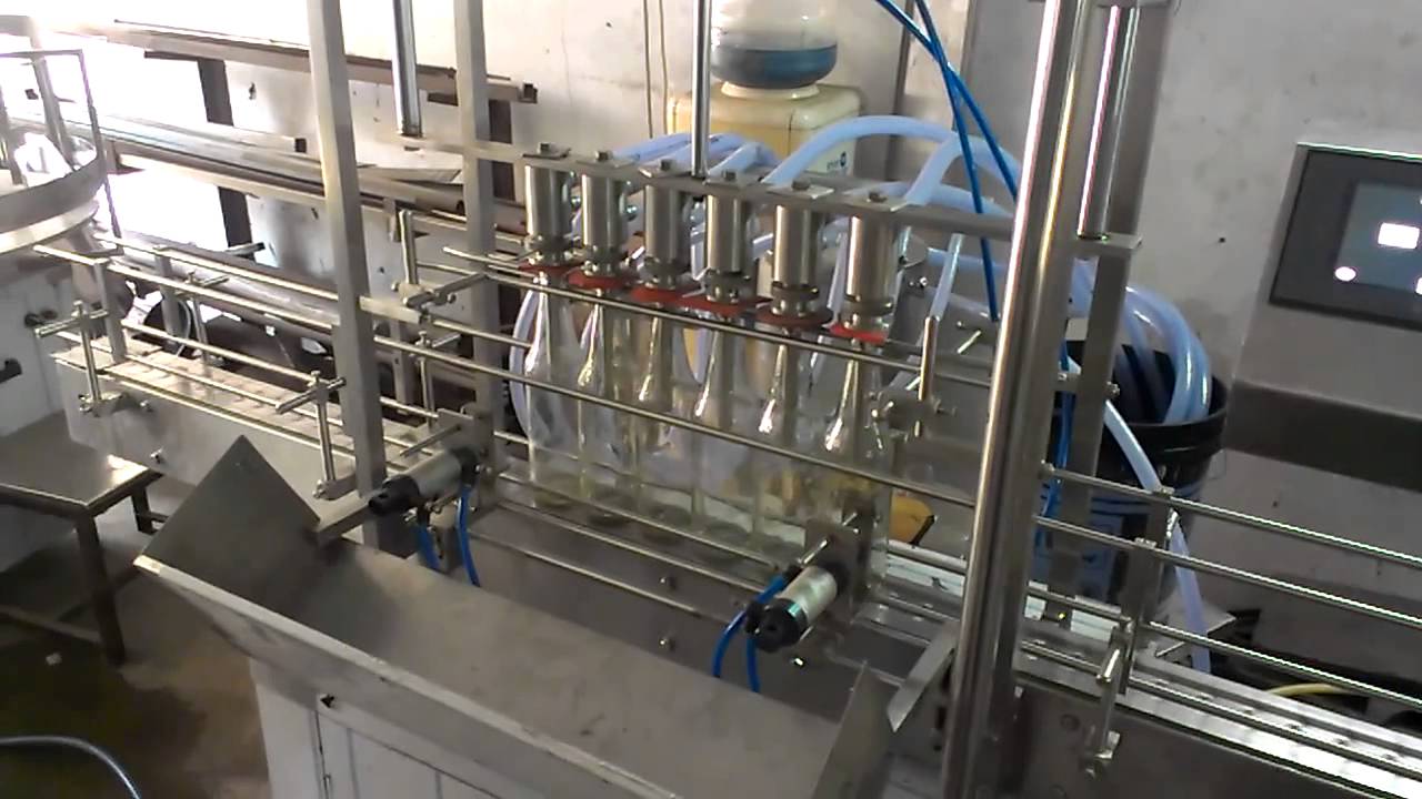 Bottle Vacuum filling machine , Overflow Filler for Glass bottle - YouTube