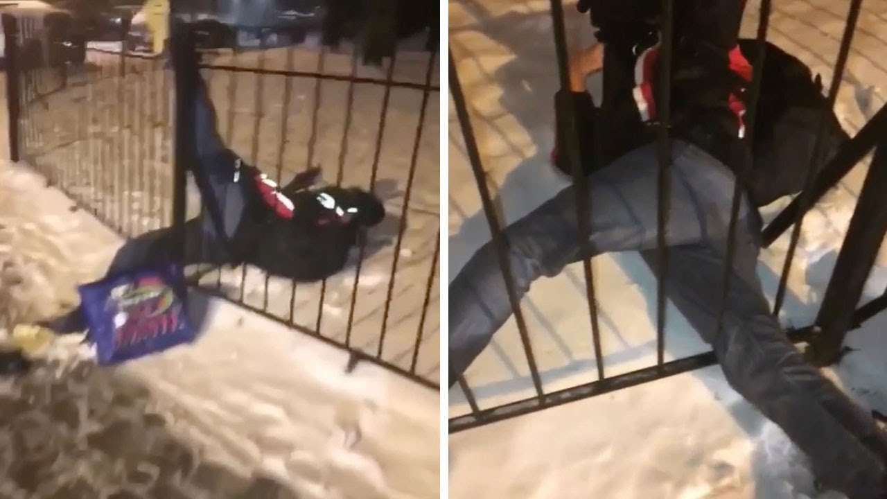 Pedestrian Finds Man Stuck In Fence - YouTube