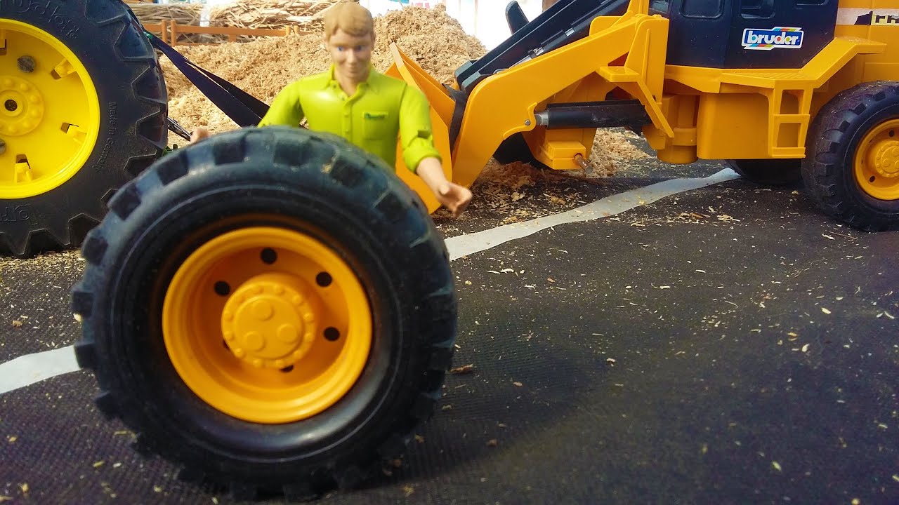BRUDER toys broken wheel! CAT front loader accident! R/C tractor saves ...