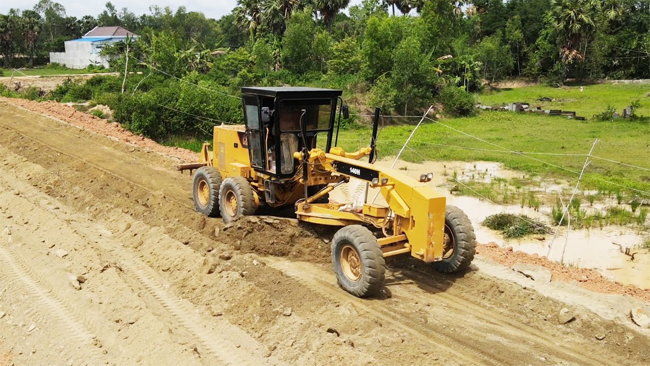 Powerful Motor Grader CAT140H Grading Gravel Road, Road Construction ...